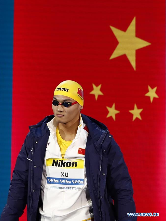 China's Sun, Xu shine with gold at worlds, three world records ...